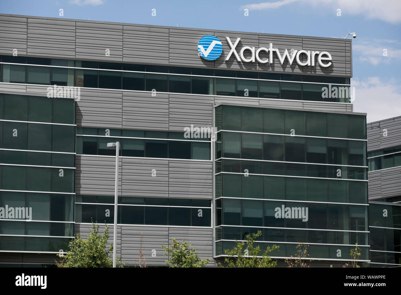 A logo sign outside of the headquarters of Xactware in Lehi, Utah on ...