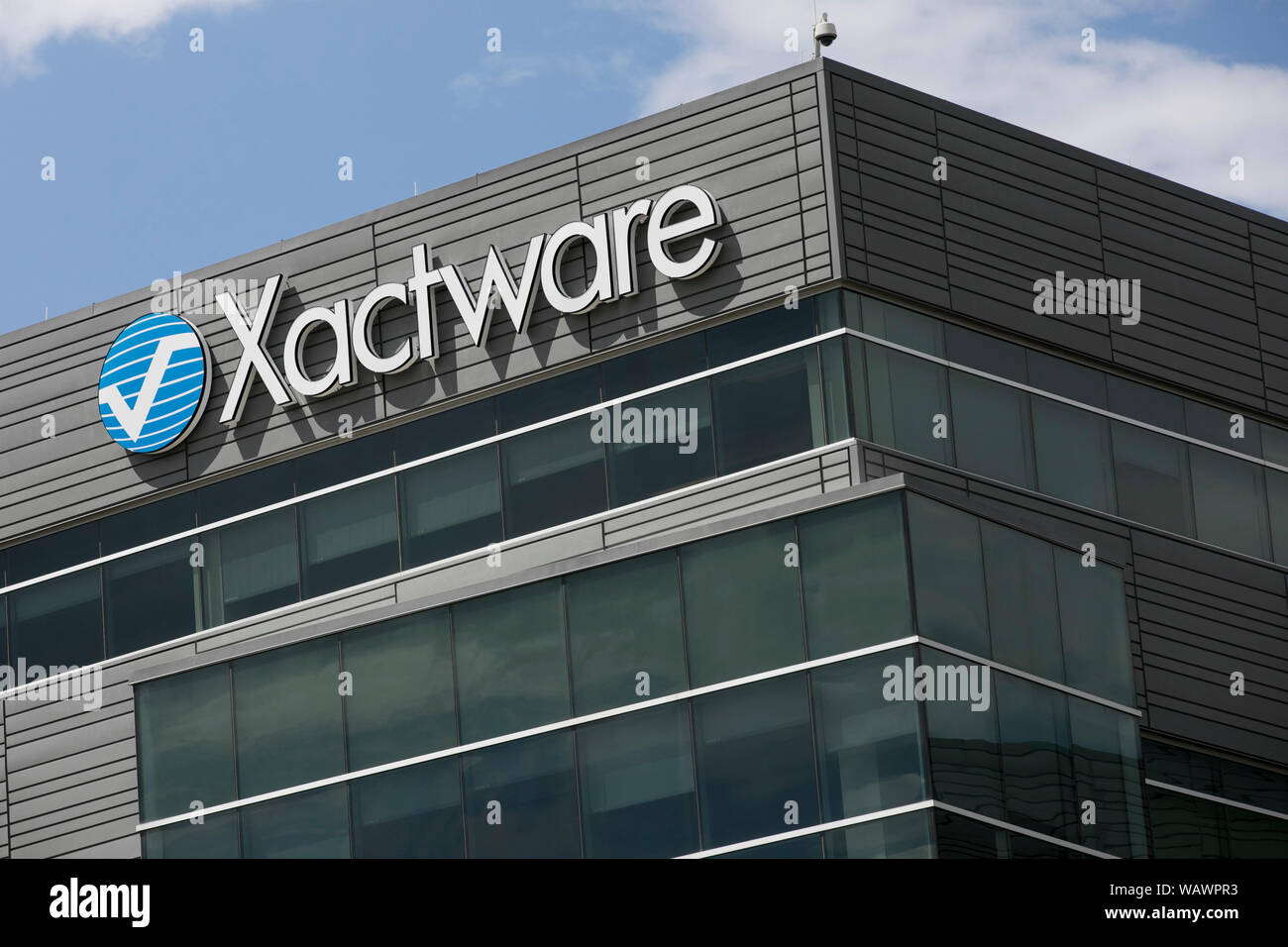 A logo sign outside of the headquarters of Xactware in Lehi, Utah on ...