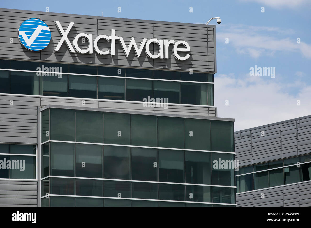 A logo sign outside of the headquarters of Xactware in Lehi, Utah on ...