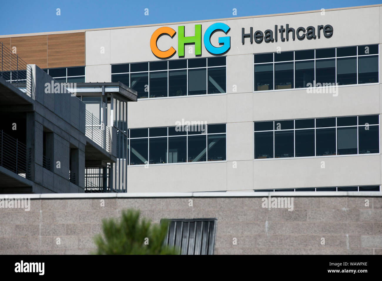 A logo sign outside of the headquarters of CHG Healthcare in Midvale ...