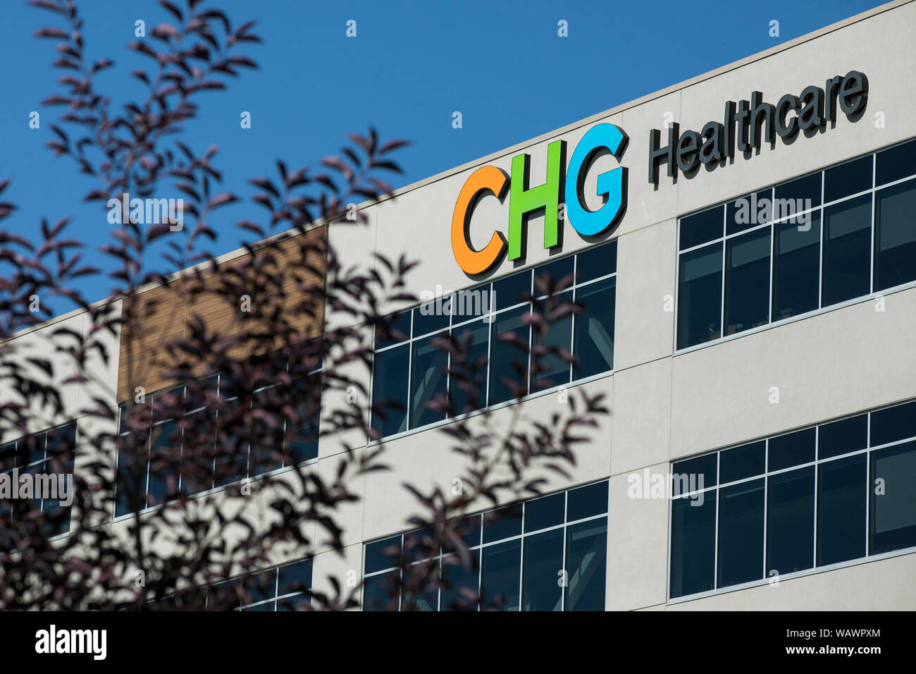 A logo sign outside of the headquarters of CHG Healthcare in Midvale ...