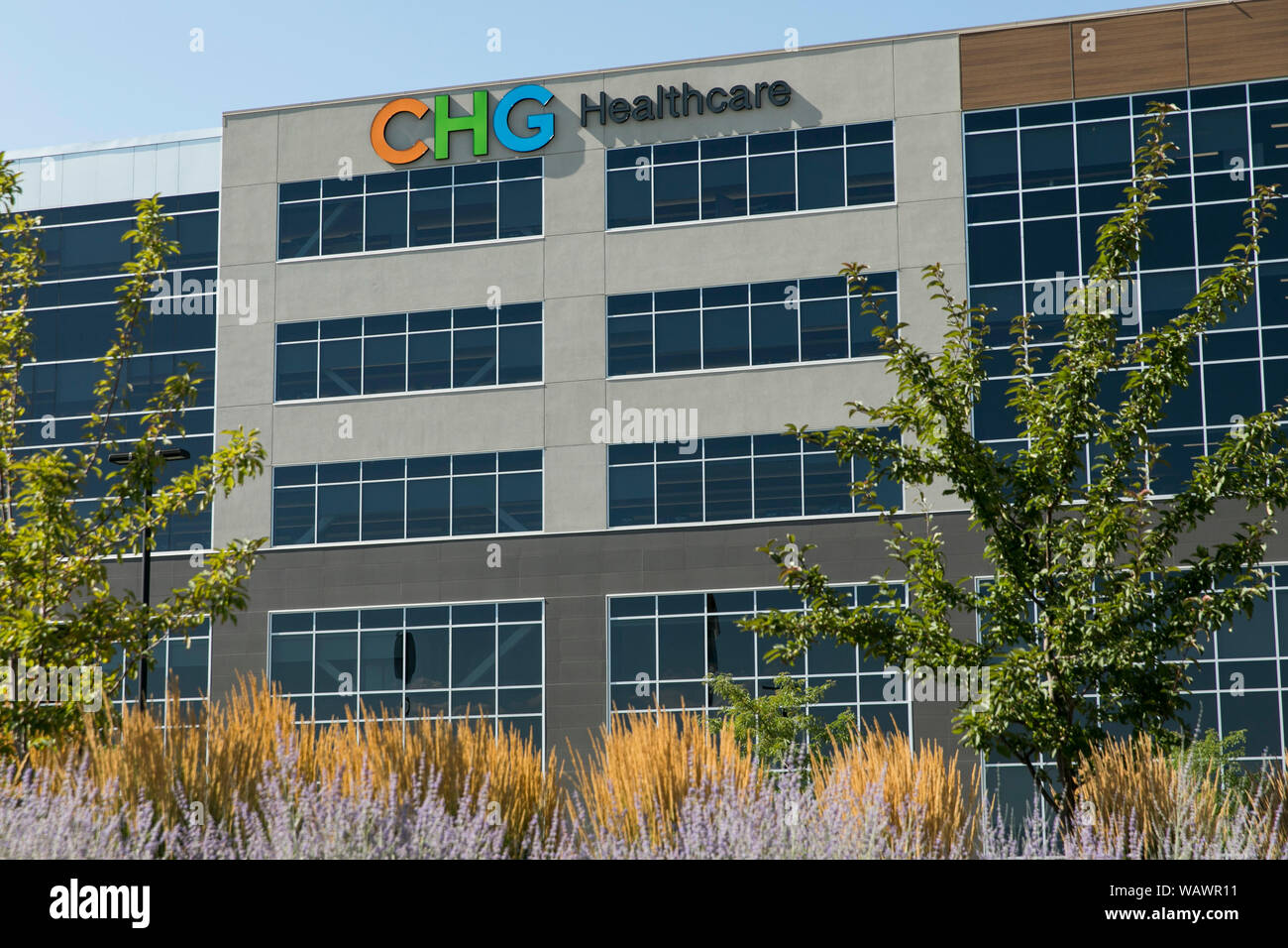 A logo sign outside of the headquarters of CHG Healthcare in Midvale ...