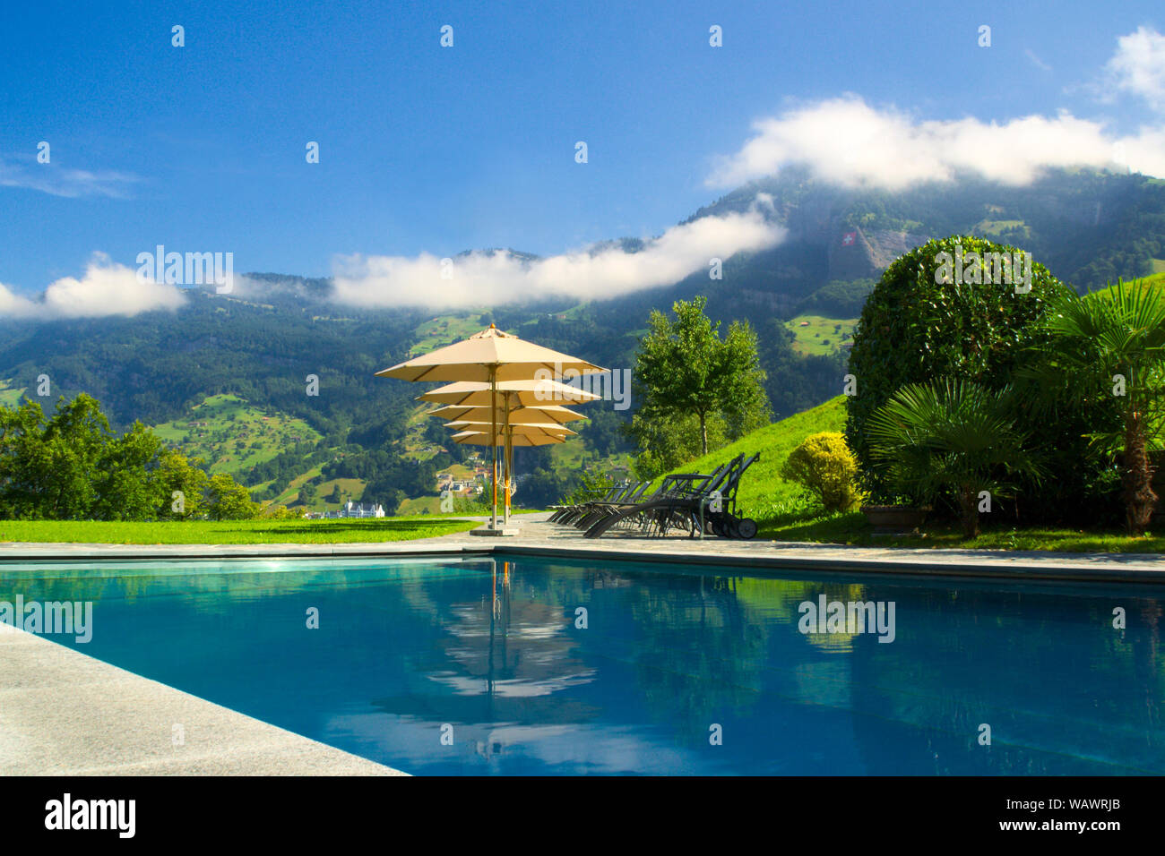 Luxury resort with pool overlooking the mountains, Switzerland Stock ...