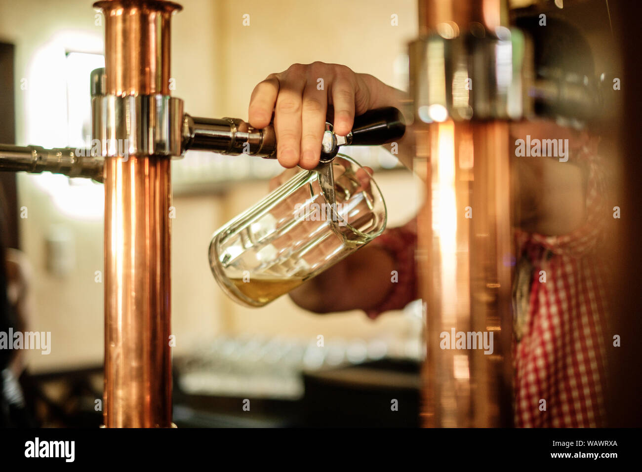 Craft draft beer poured into a glass Stock Photo - Alamy