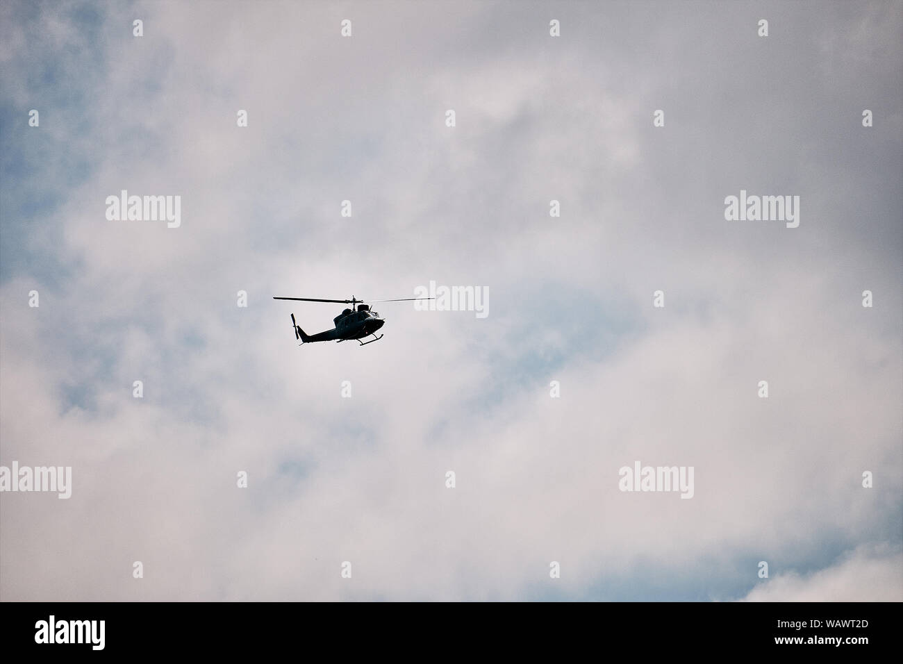 helicopter flying over the clouds at high altitude Stock Photo - Alamy
