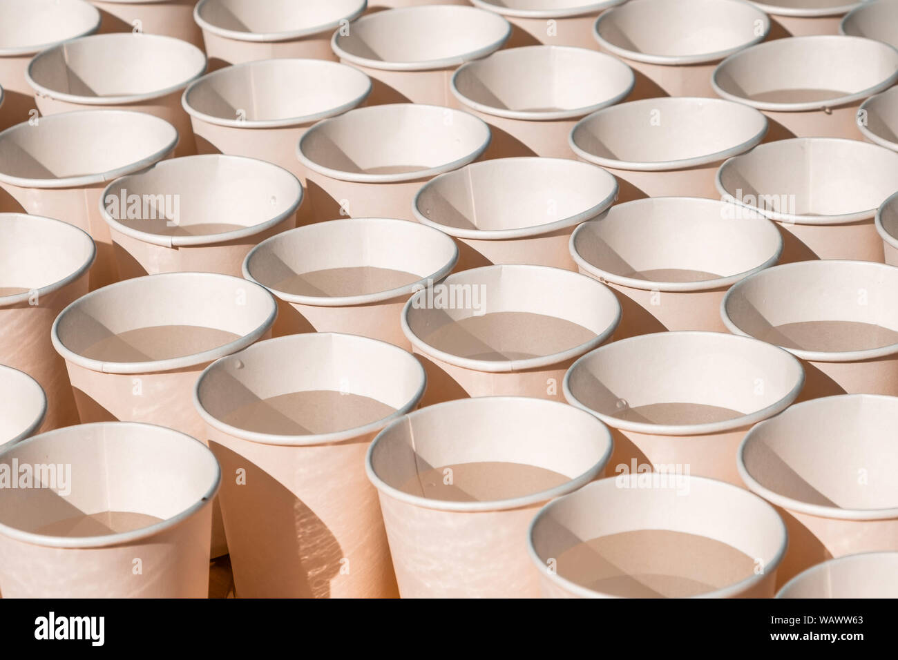 Paper cups filled with water - light and shadow geometric pattern Stock ...