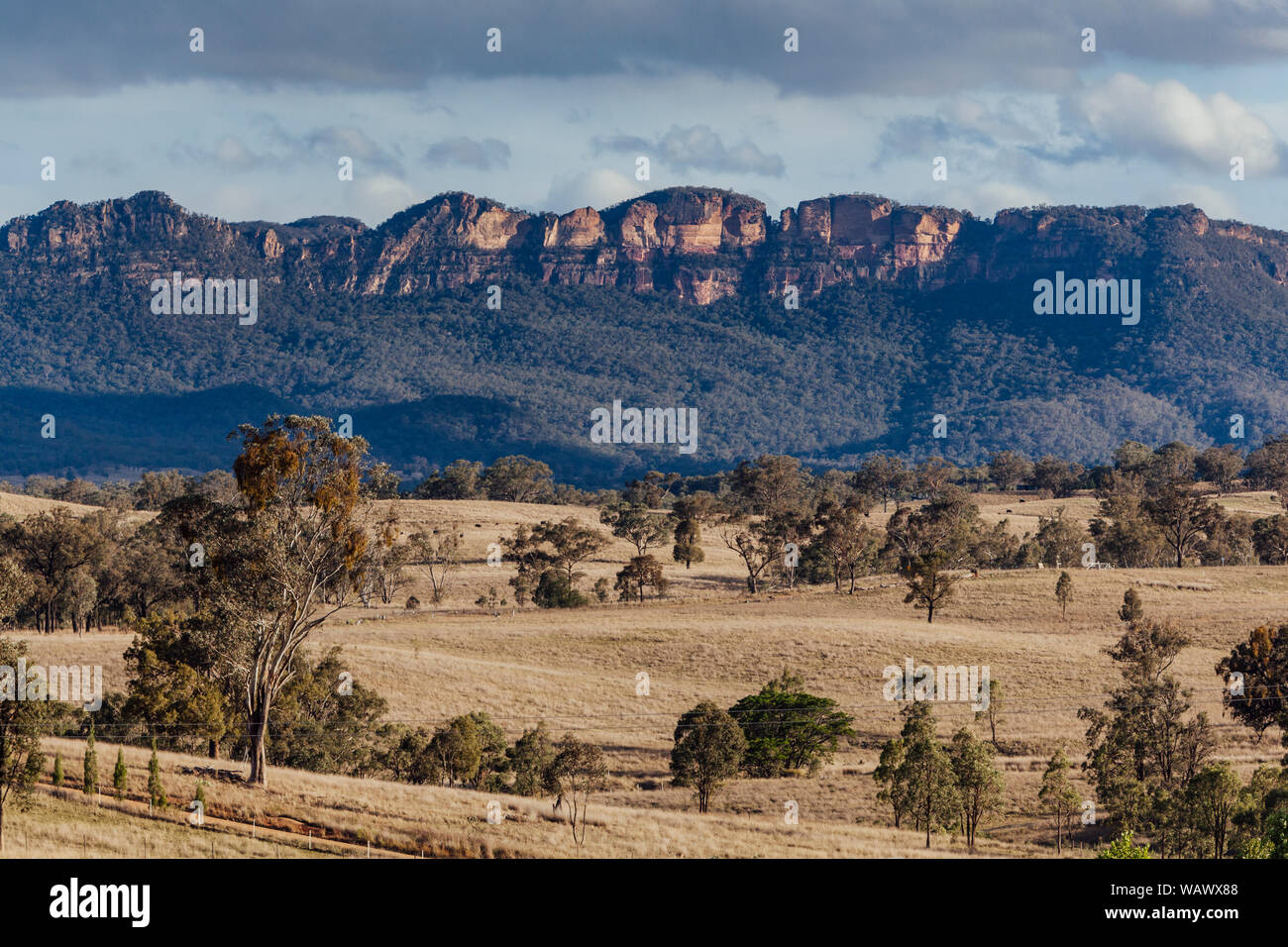 Grassy plains backed by natural bush land and rugged sandstone ridges ...