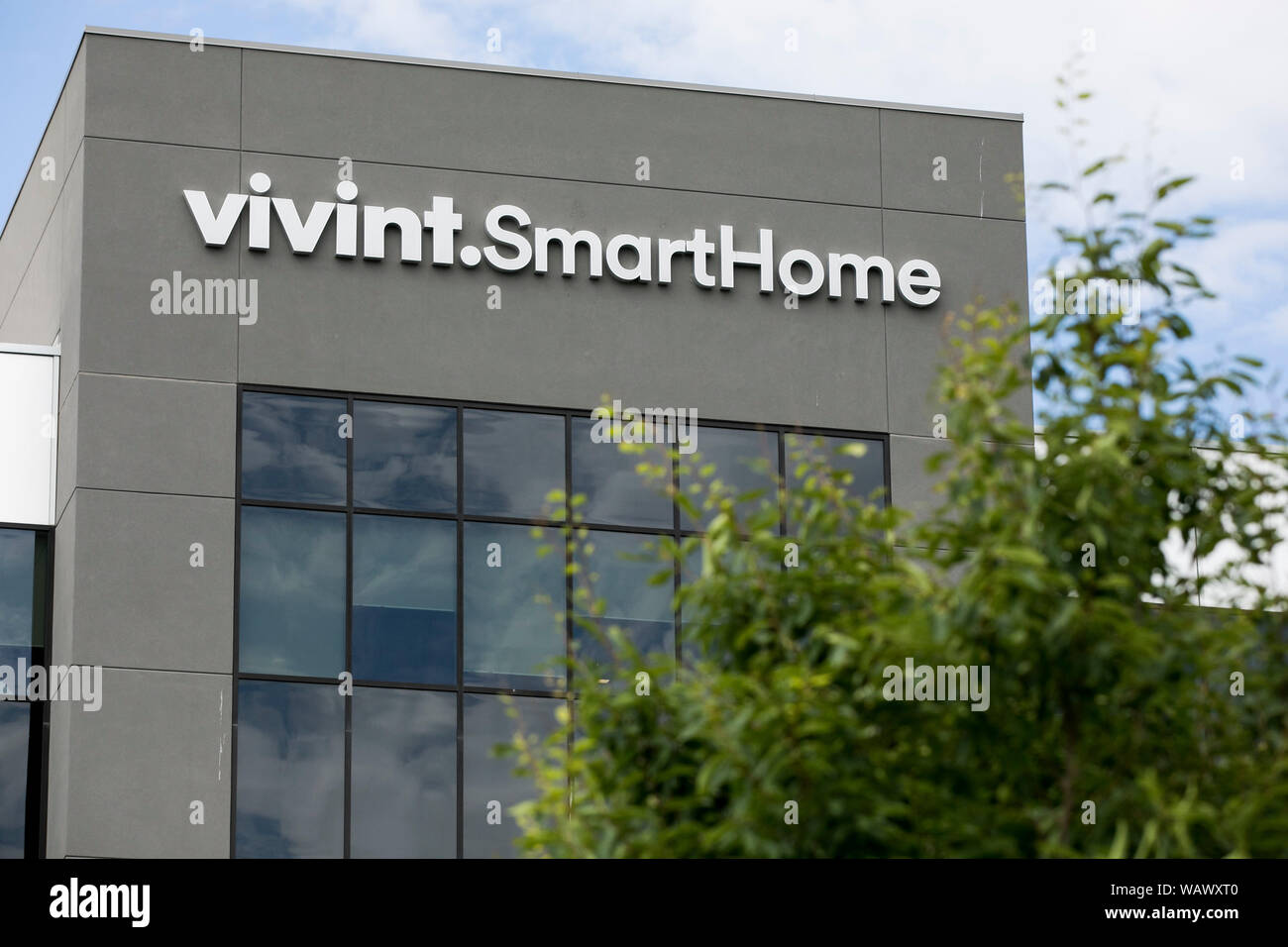 A logo sign outside of a facility occupied by Vivint Smart Home in Lehi ...