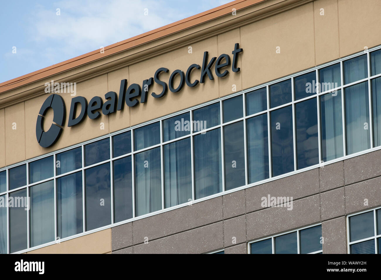 A logo sign outside of a facility occupied by DealerSocket in Draper ...