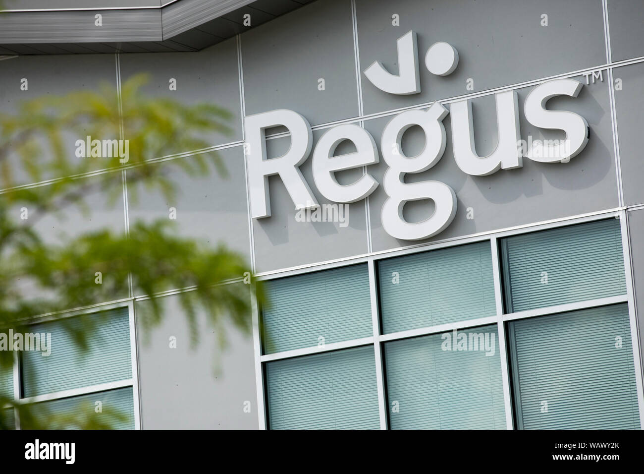 A logo sign outside of a Regus office space in Draper, Utah on July 27 ...