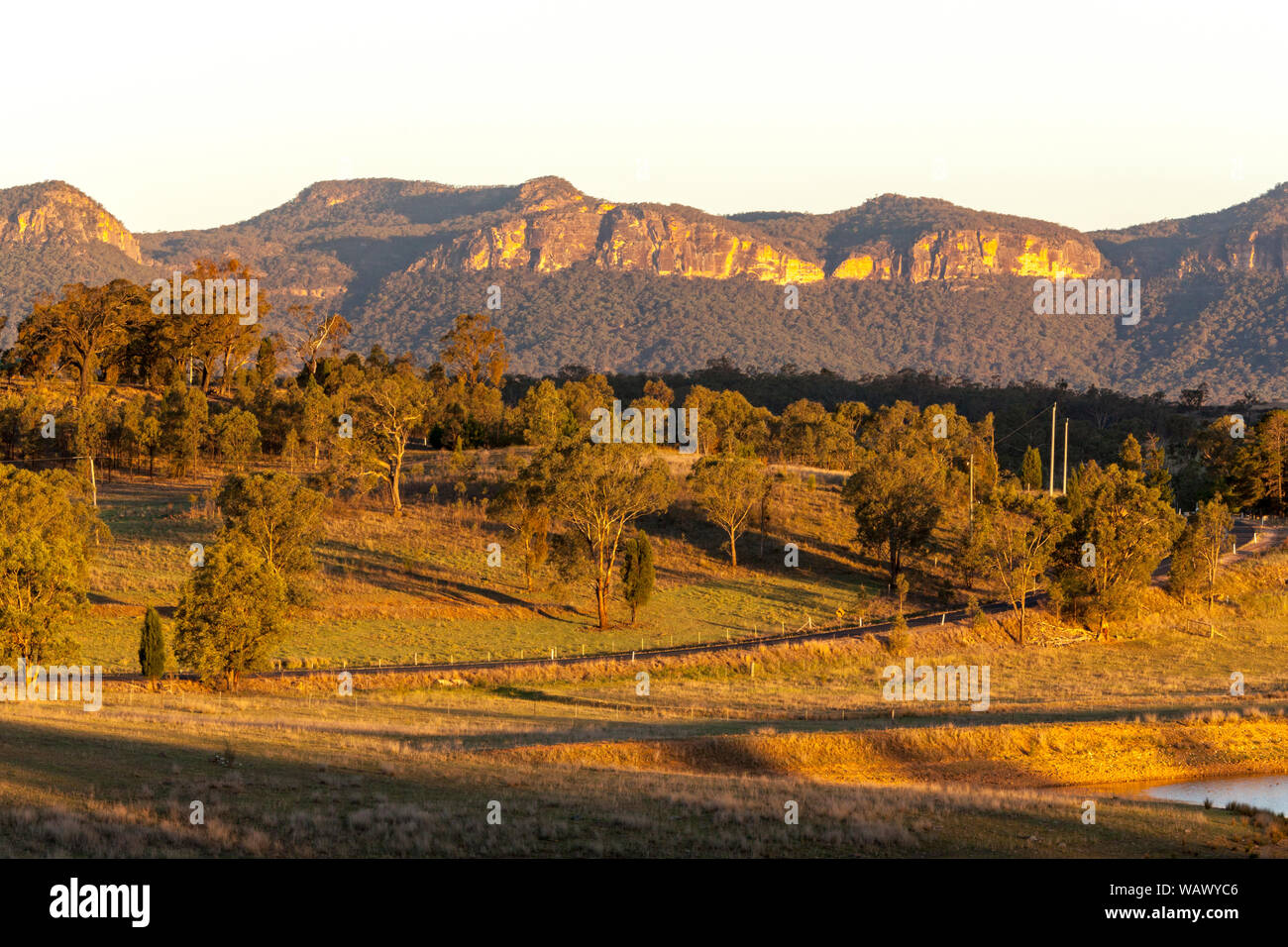 Sandstone ridges and natural bush land at sunset in the Capertee Valley ...