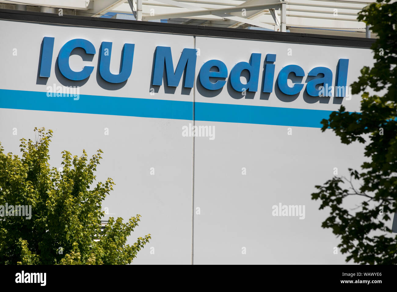 A logo sign outside of a facility occupied by ICU Medical in Salt Lake ...
