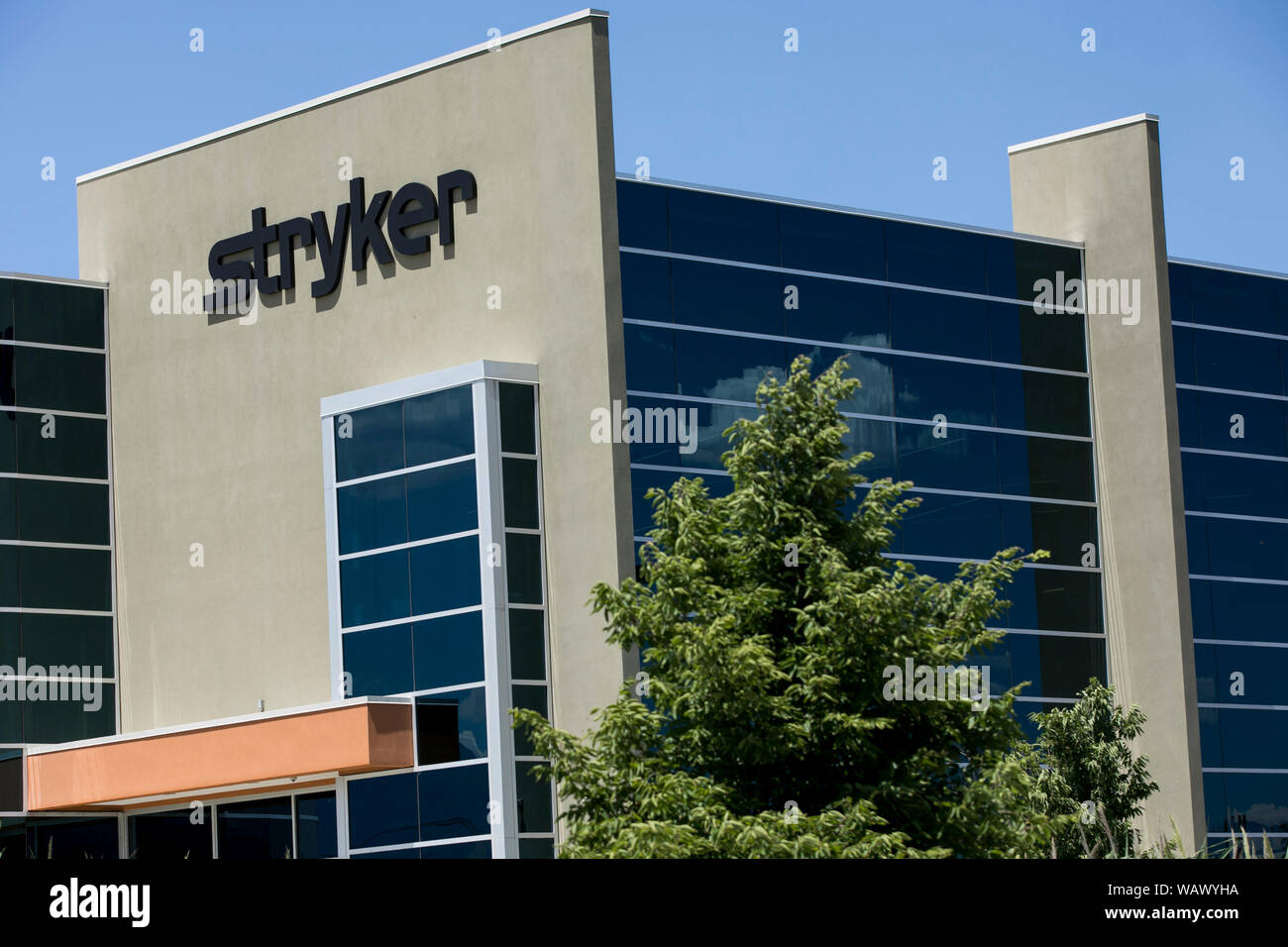 A logo sign outside of a facility occupied by the Stryker Corporation ...