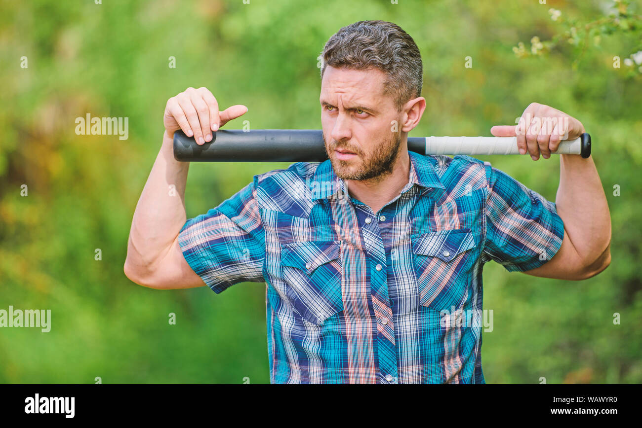 Confident in his strength. Bully guy in nature with cudgel. Wild energy ...