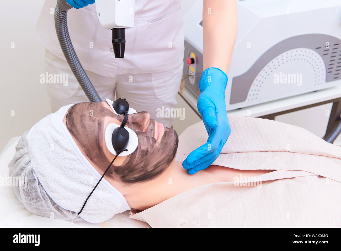 Procedure carbon facial peeling in the clinic of laser cosmetology ...