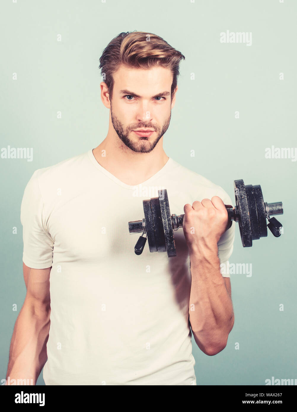 mens power. man lifting barbell. sportsman training in gym. Sport ...