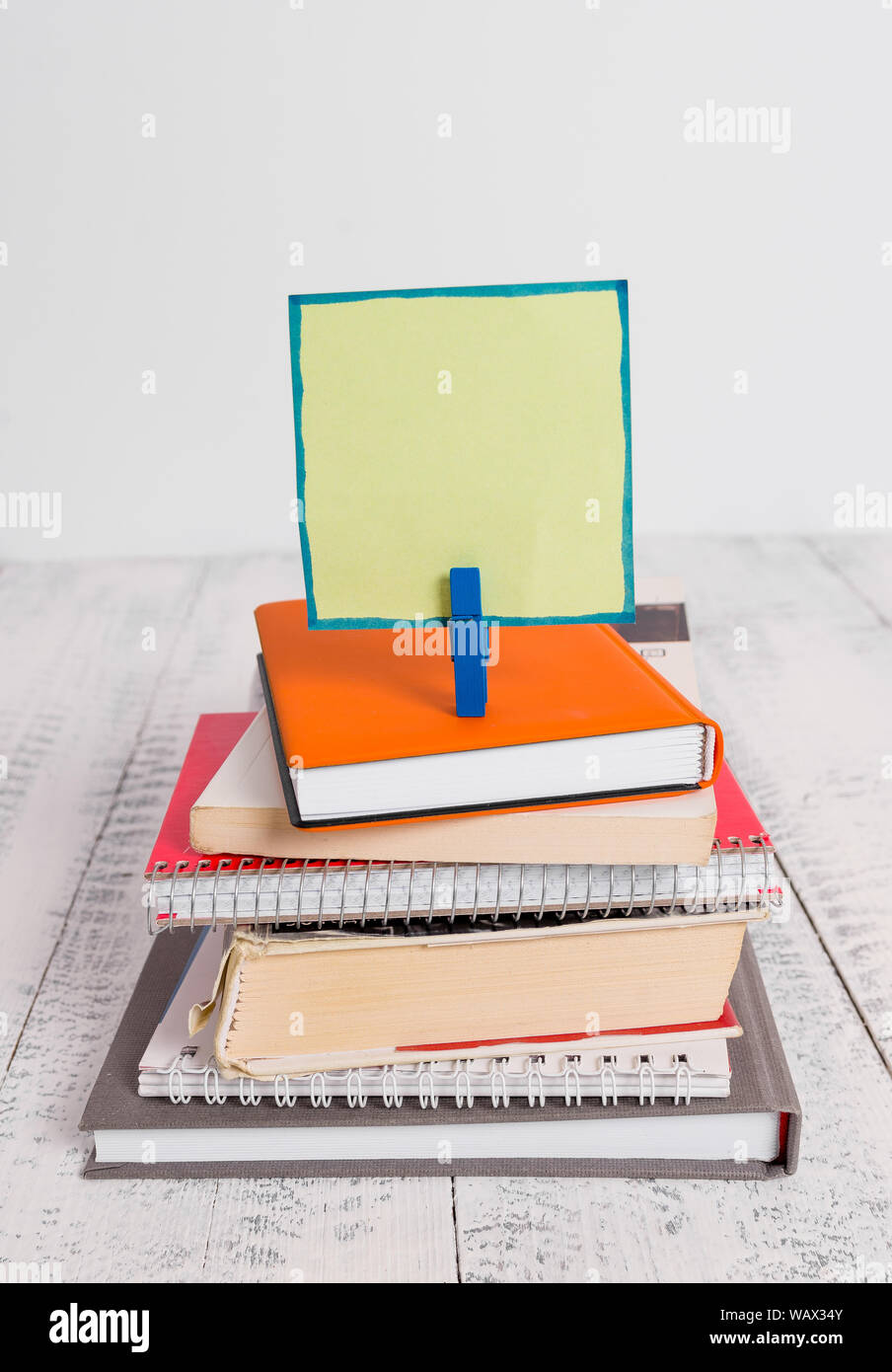 pile stacked books notebook pin clothespin colored reminder white ...