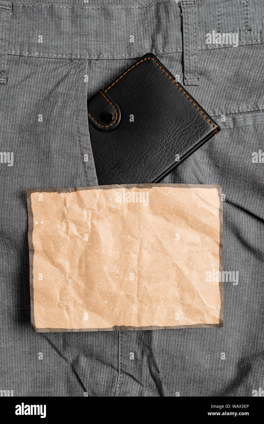 Small little wallet inside man trousers front pocket near notation ...