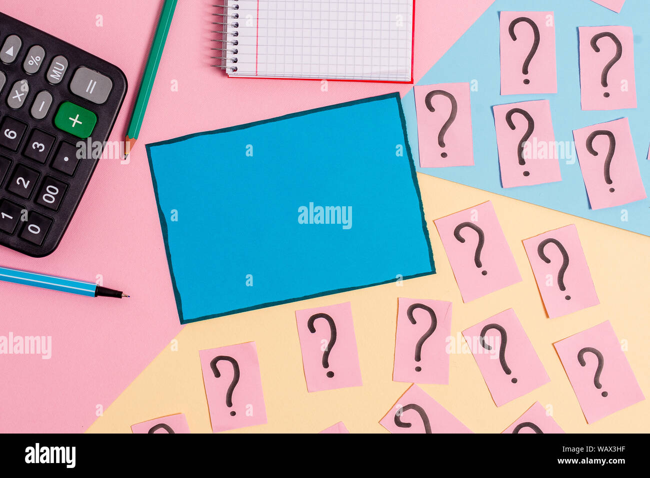 Mathematics stuff and writing equipment above pastel colours background ...