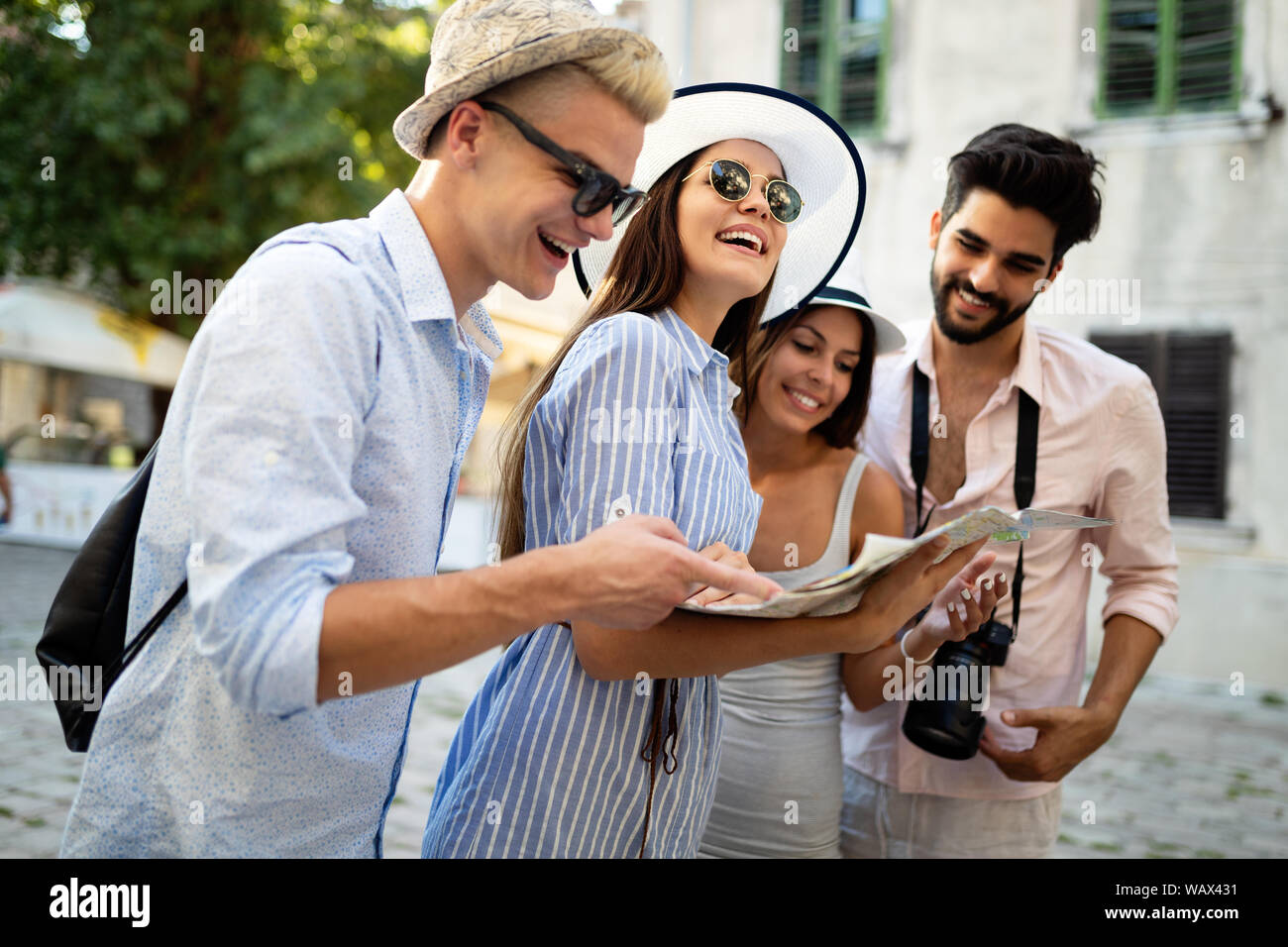 Happy group of tourists traveling and sightseeing together Stock Photo ...