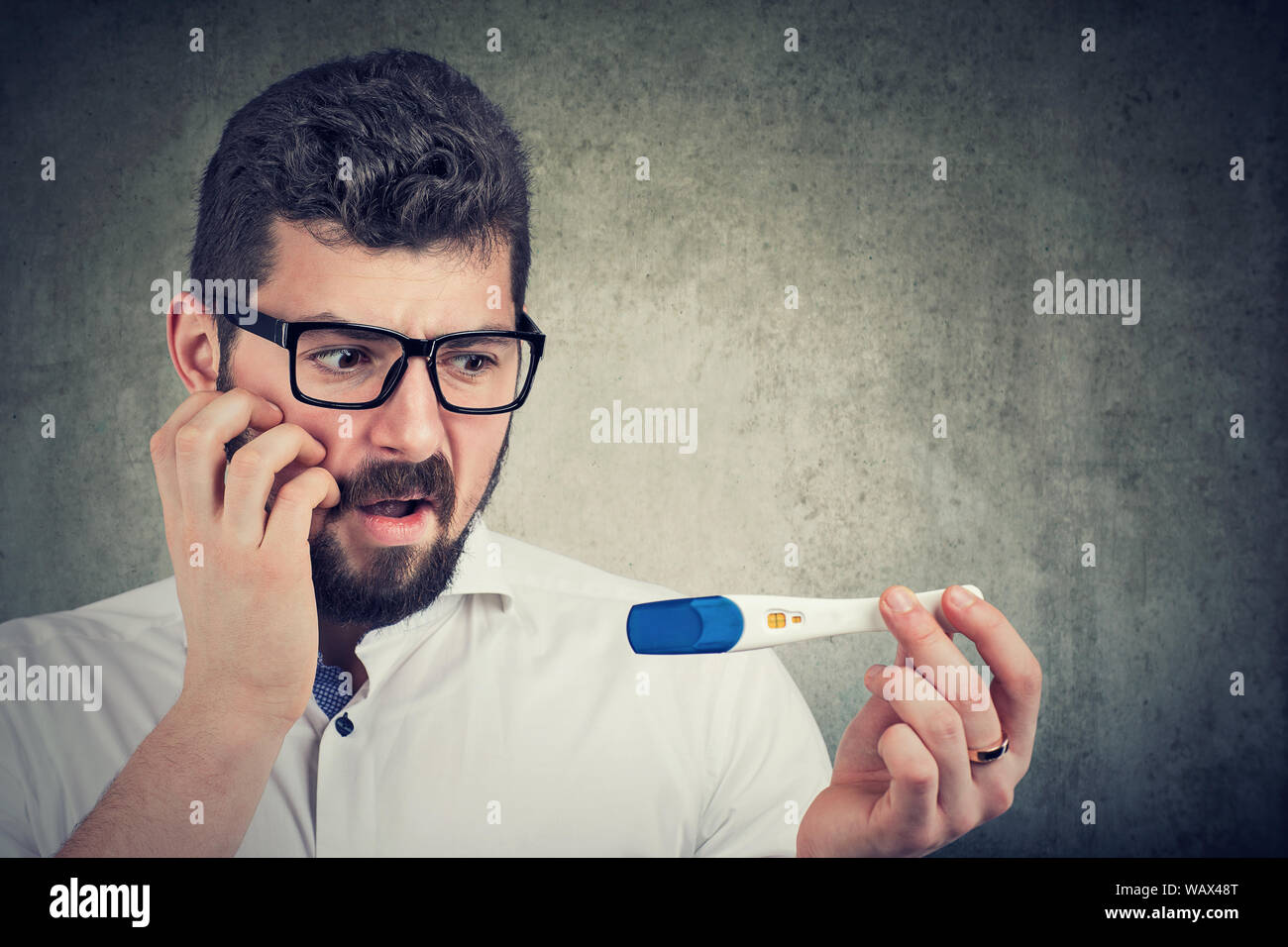 Stressed anxious man looking at a positive lab test result Stock Photo ...