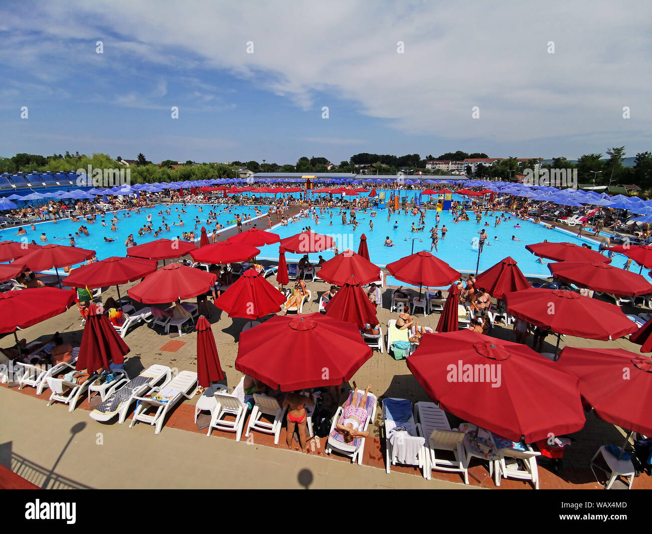 ROMAN, ROMANIA - JULY 21, 2019: Swimming pools and many peoples ...