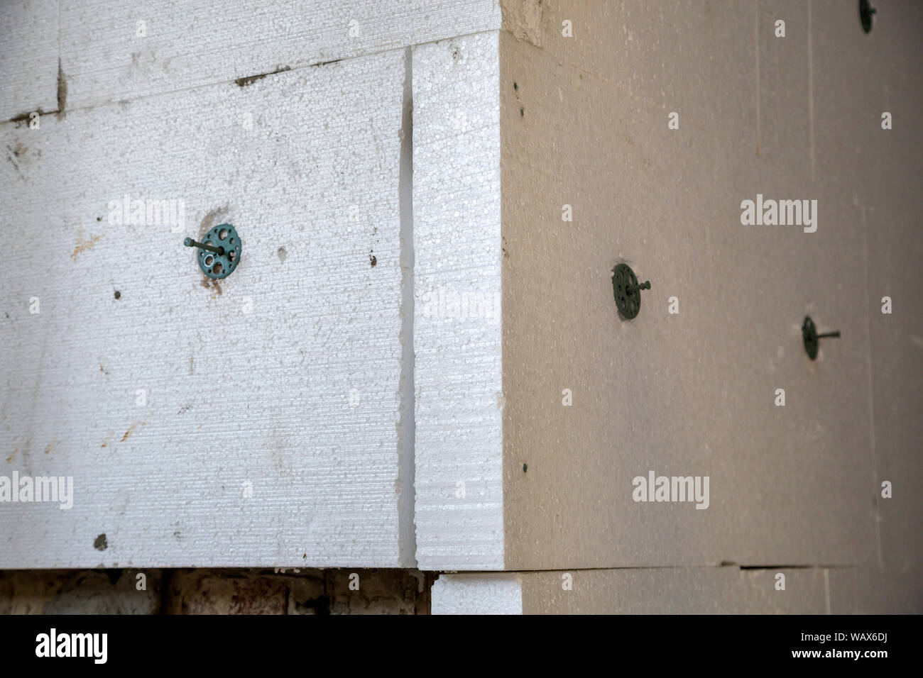 Insulation work of house walls with styrofoam sheets Stock Photo - Alamy
