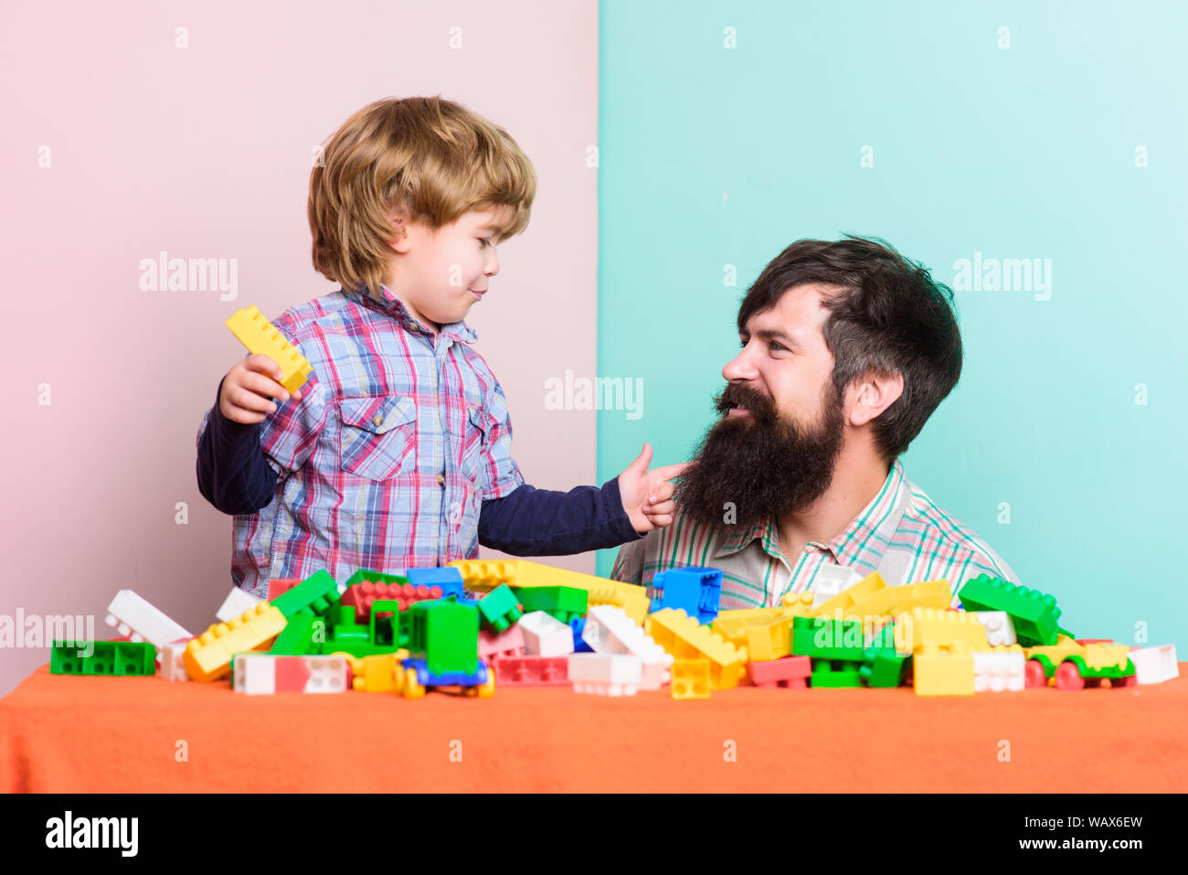 building home with colorful constructor. child development. father and ...