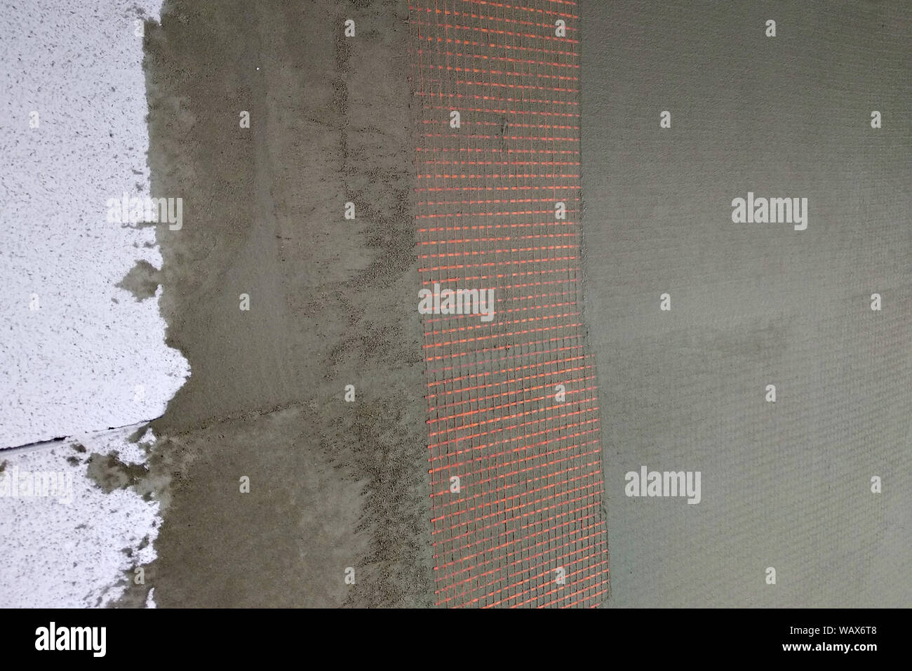 Closeup of layers over styrofoam insulation, mesh, plaster, cement ...