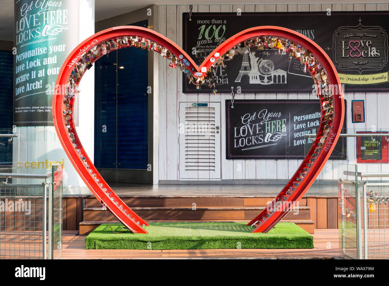 A heart shape structure on a green turf that is locked with many ...