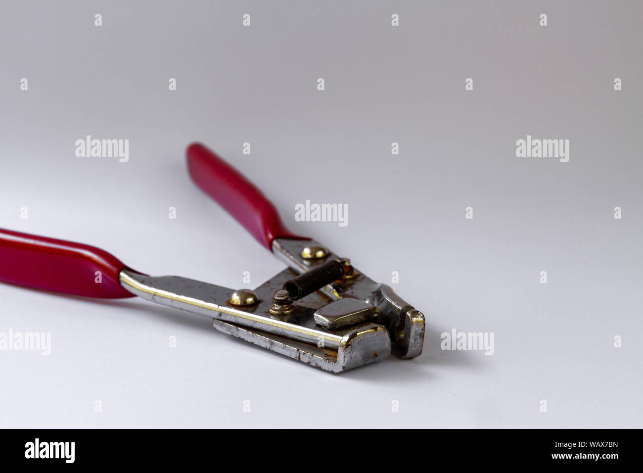 An old and well-used third hand tool used for adjusting brake and gear ...