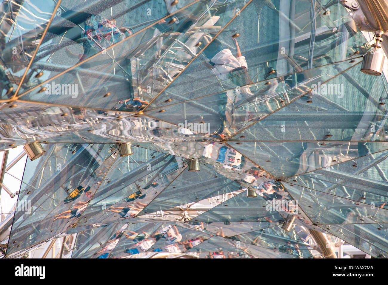 Industrial glass ceiling abstract reflection at The Helix Bridge ...