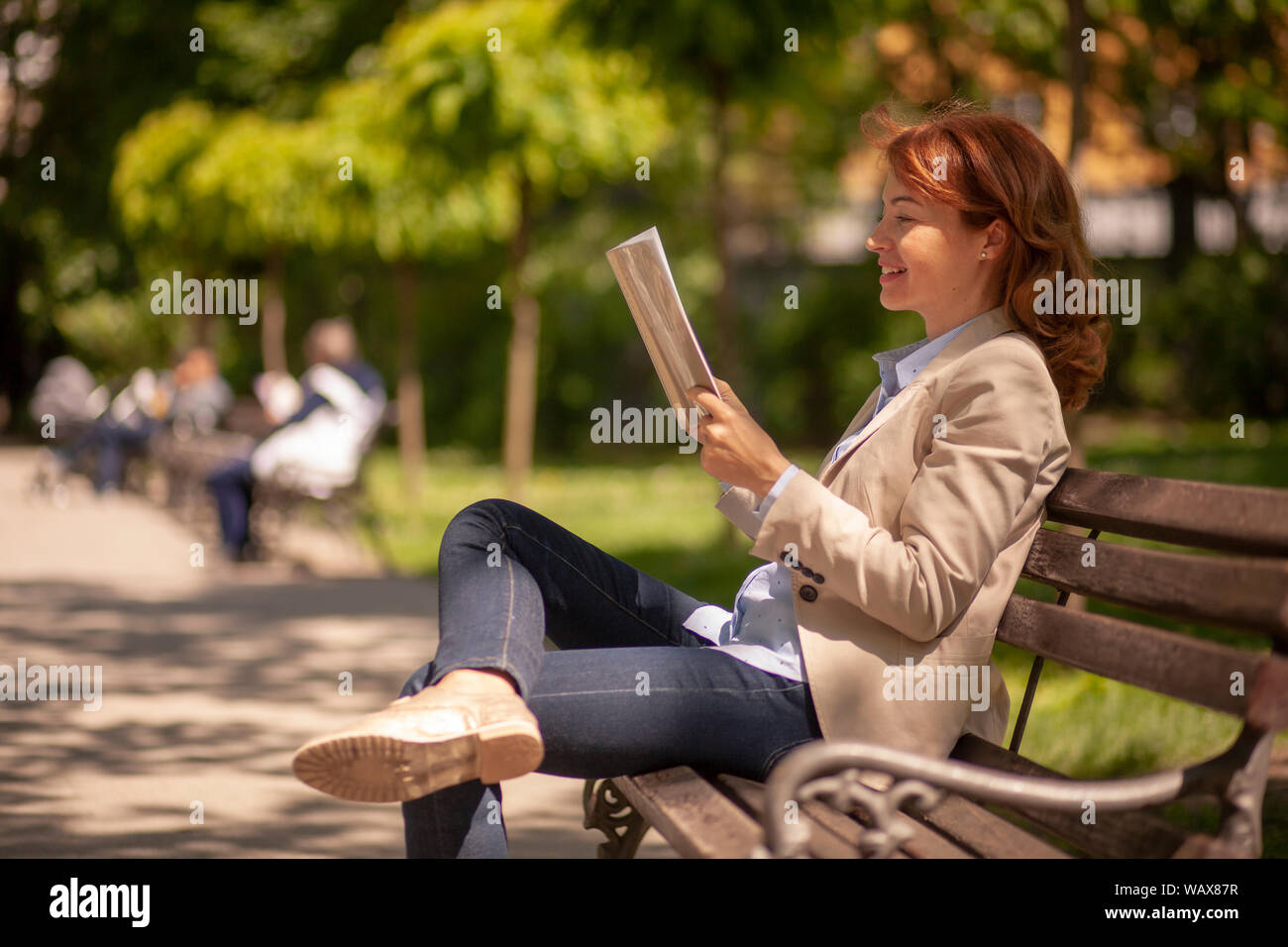 Girl Sitting Alone On Bench Reading
