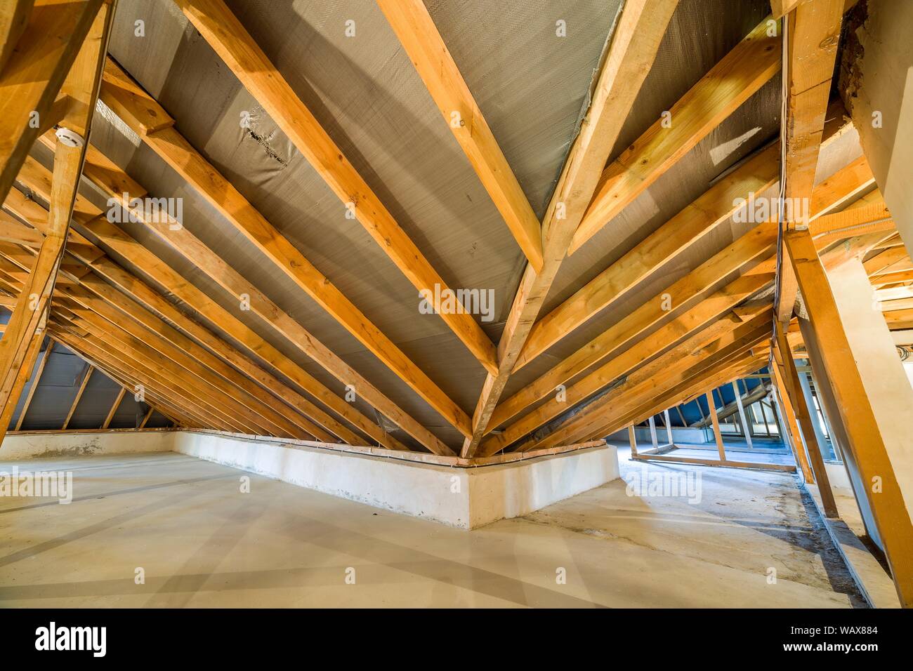 Attic of a building with wooden beams of a roof structure Stock Photo ...