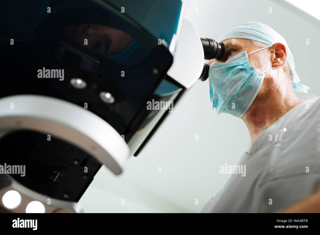 Low angle of a nice professional male doctor Stock Photo - Alamy