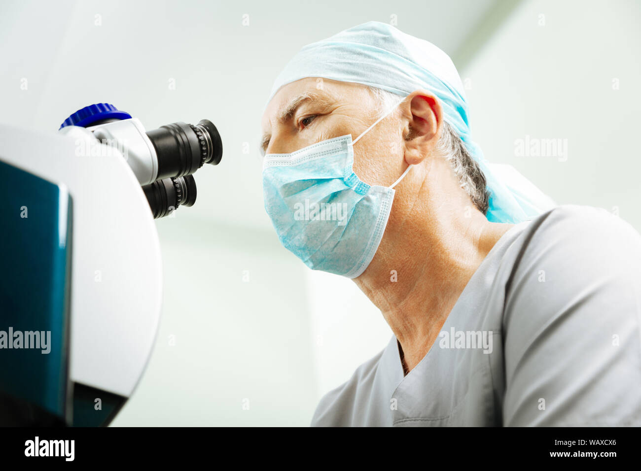Doctor checking eyes hi-res stock photography and images - Alamy