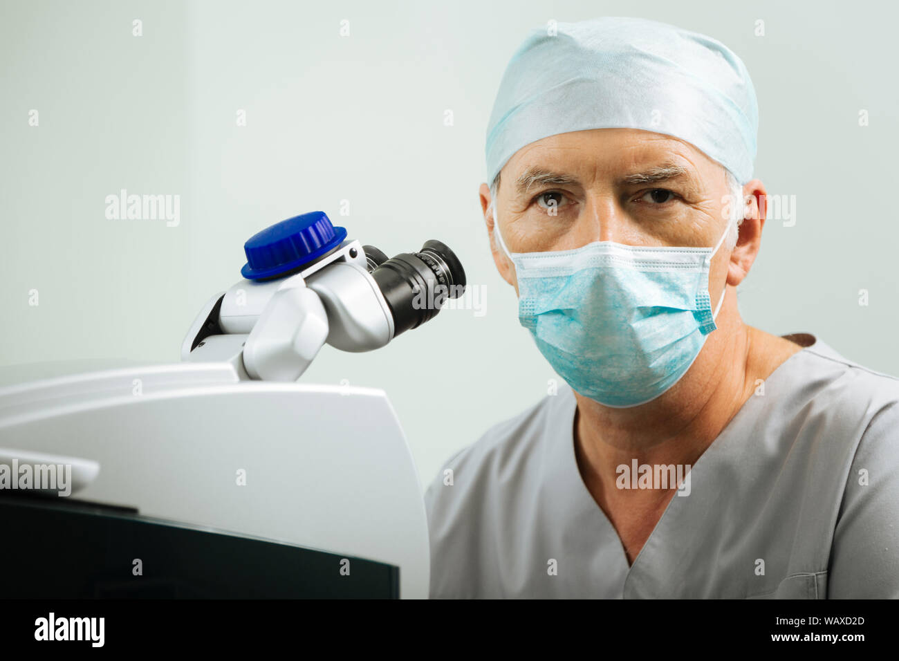 Smart hard working doctor looking at you Stock Photo - Alamy
