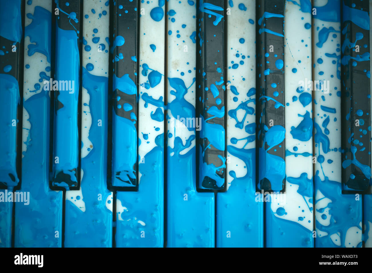 an old piano is painted in blue color Stock Photo - Alamy