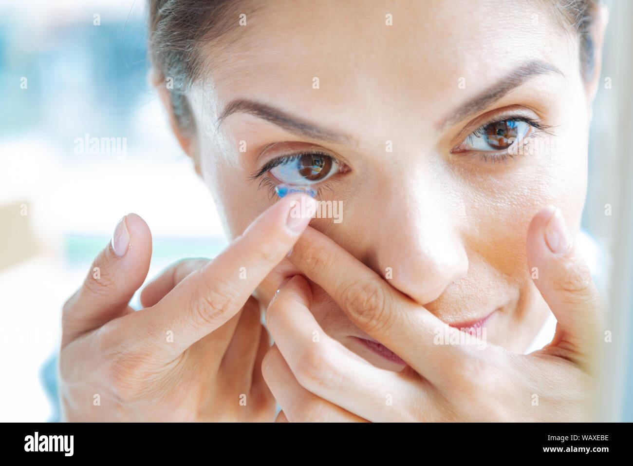 Eye contact eyes contacts hi-res stock photography and images - Alamy