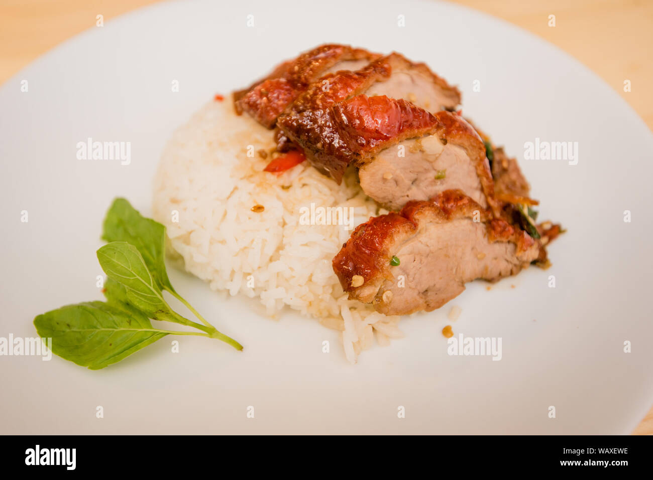 stir-fried roasted duck and basil and fried egg with rice, Thai food ...