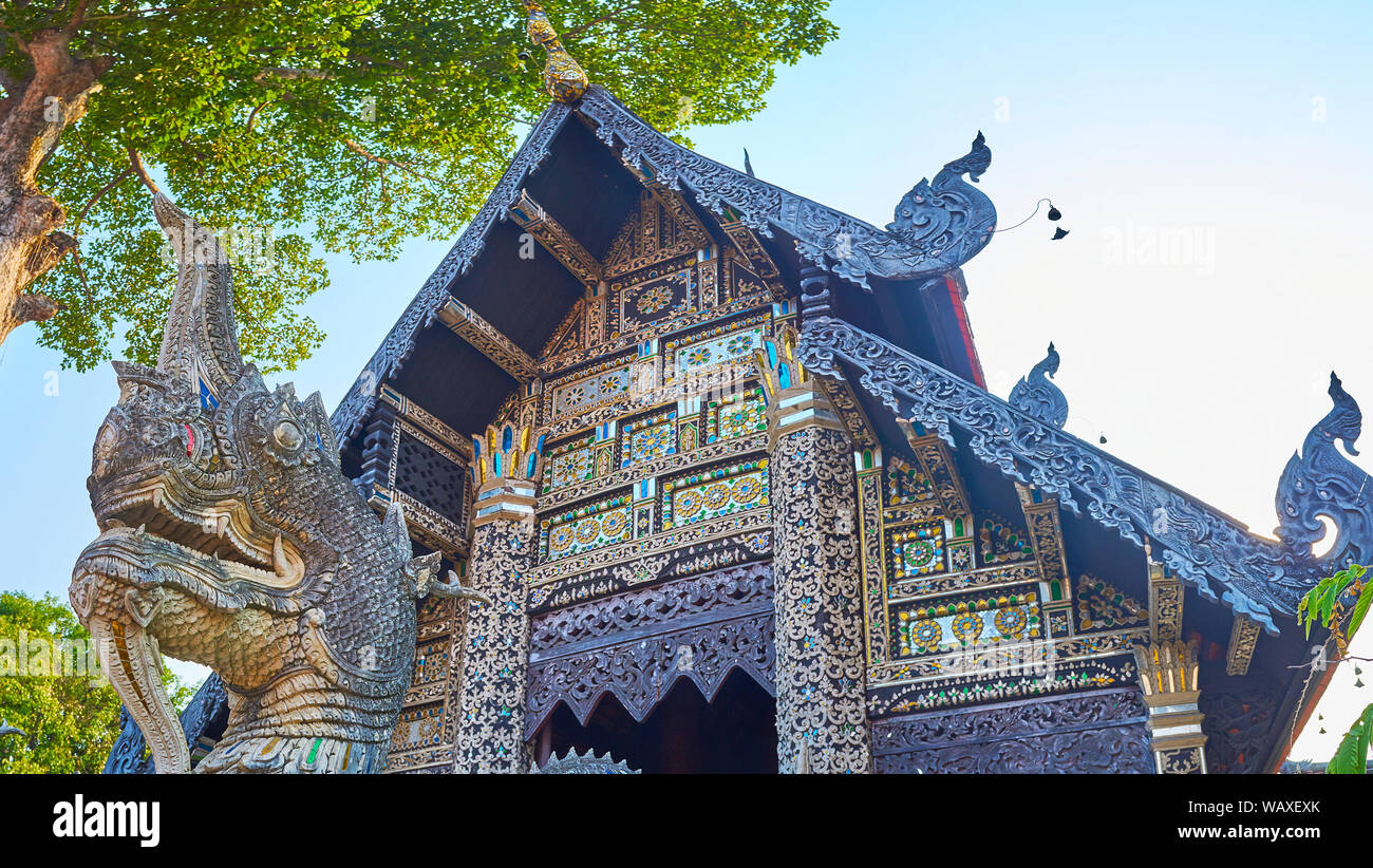 Rich decorations of Bhuridatto Viharn - Naga serpent in front of hall ...