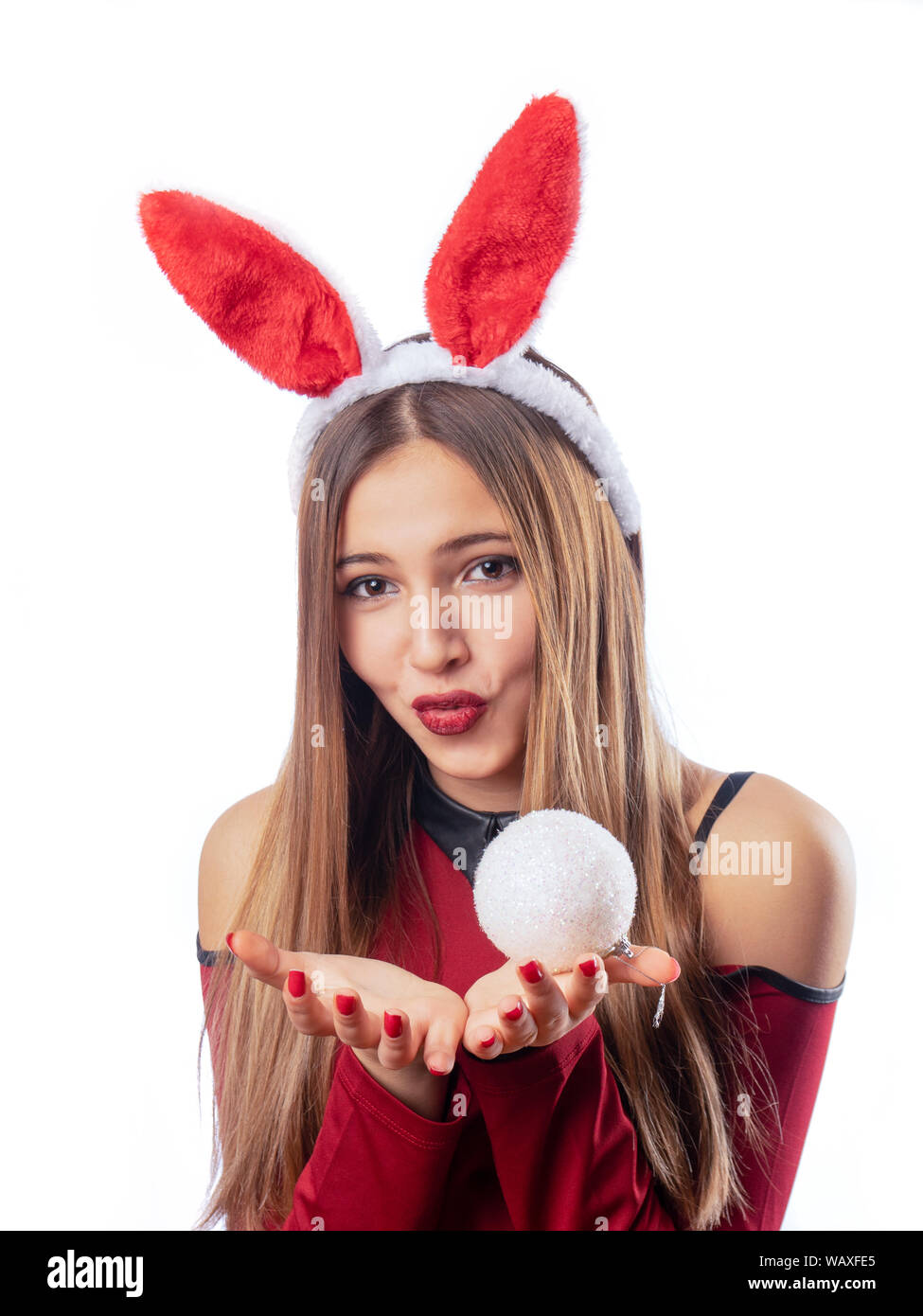Beautiful girl with rabbit accessory posing on white background ...