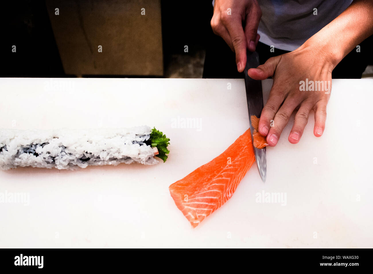 Chef cutting fresh salmon sashimi, top angle shot Stock Photo - Alamy