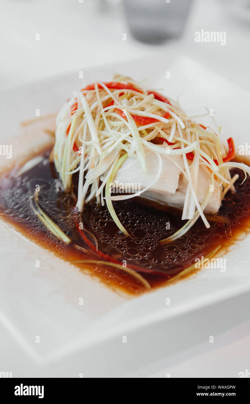 Chinese style steamed Snapper filet fish with sesame oil soy sauce and ...