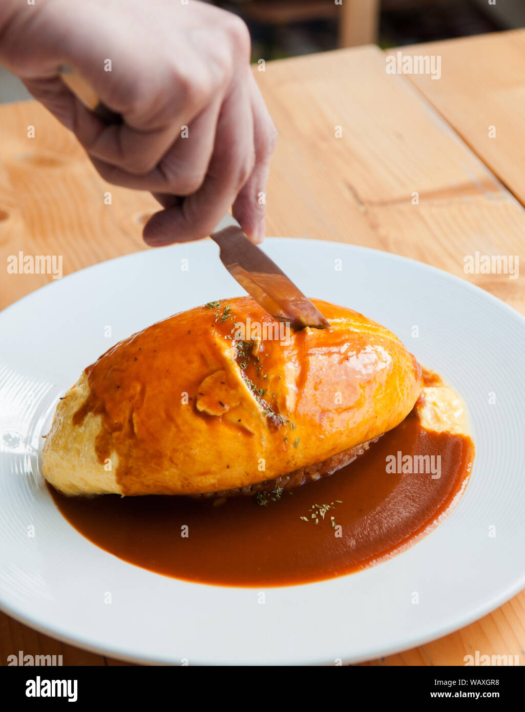 Japanese hayashi sauce Omu rice, Japanese omelette rice demi glace sauce Stock Photo - Alamy
