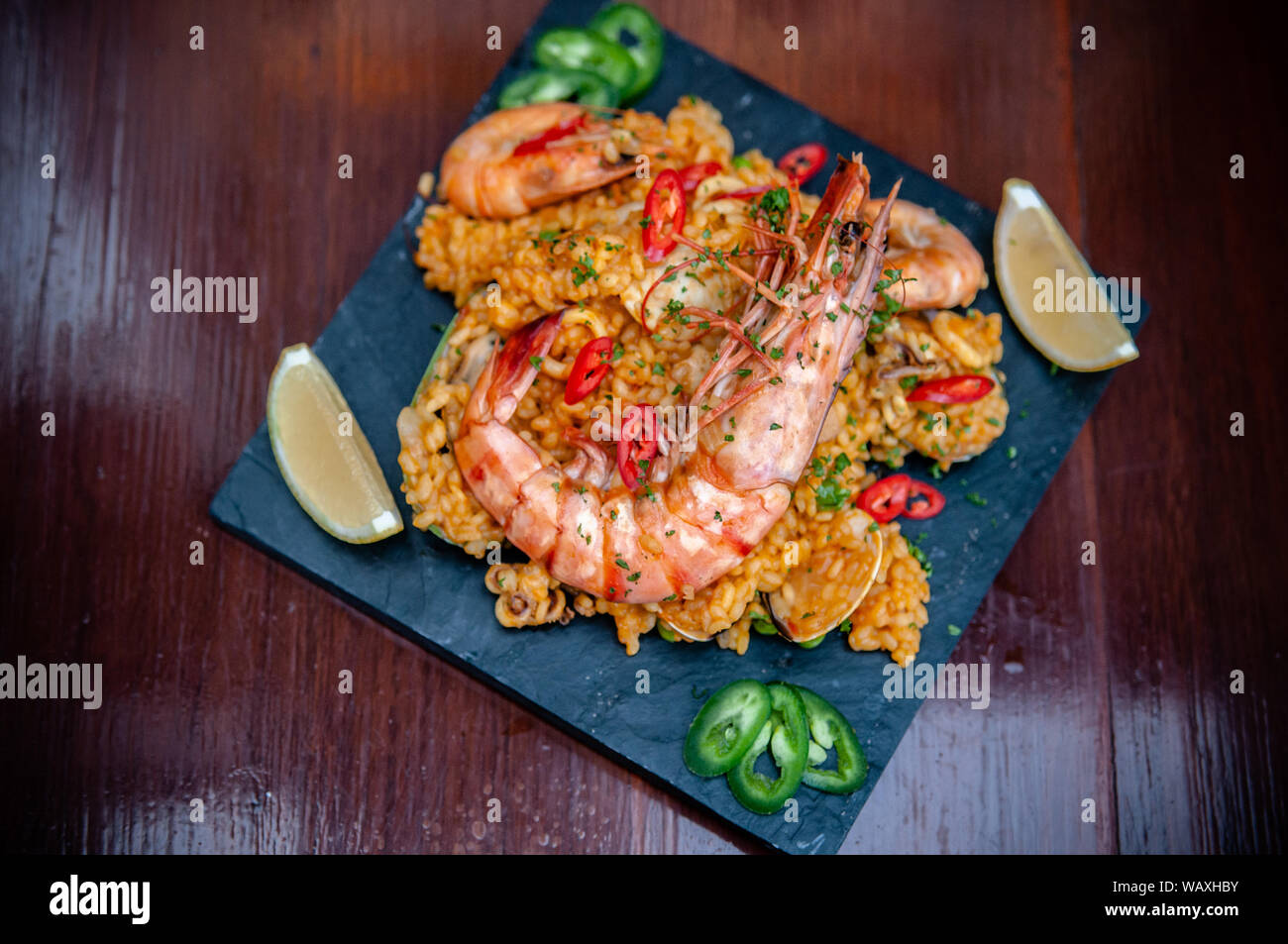 King prawn Paella Spanish seafood Paella rice with red and green pepper ...