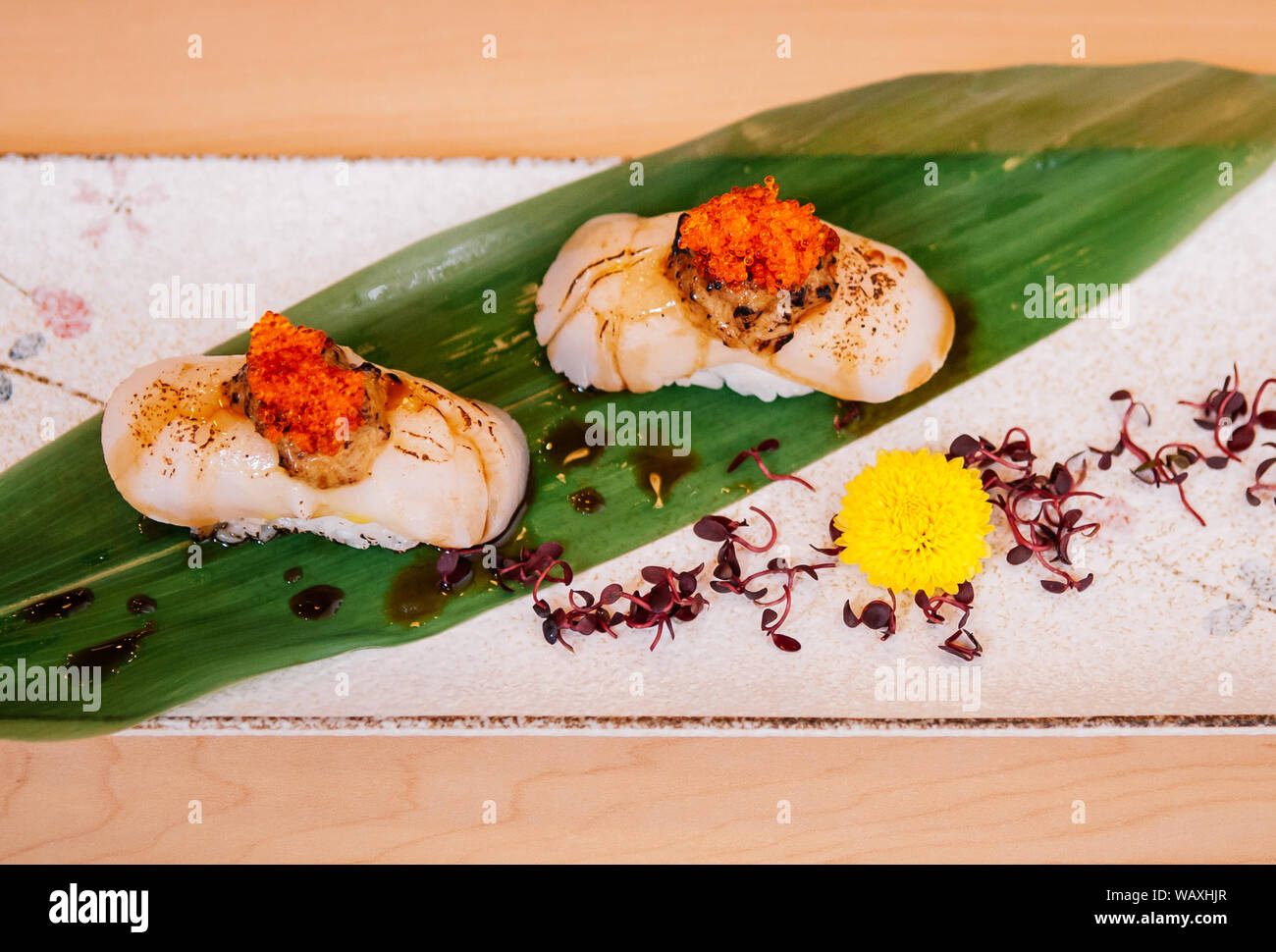 Fresh beautiful pieces of Japanese Engawa sushi with shrimp roe on ...