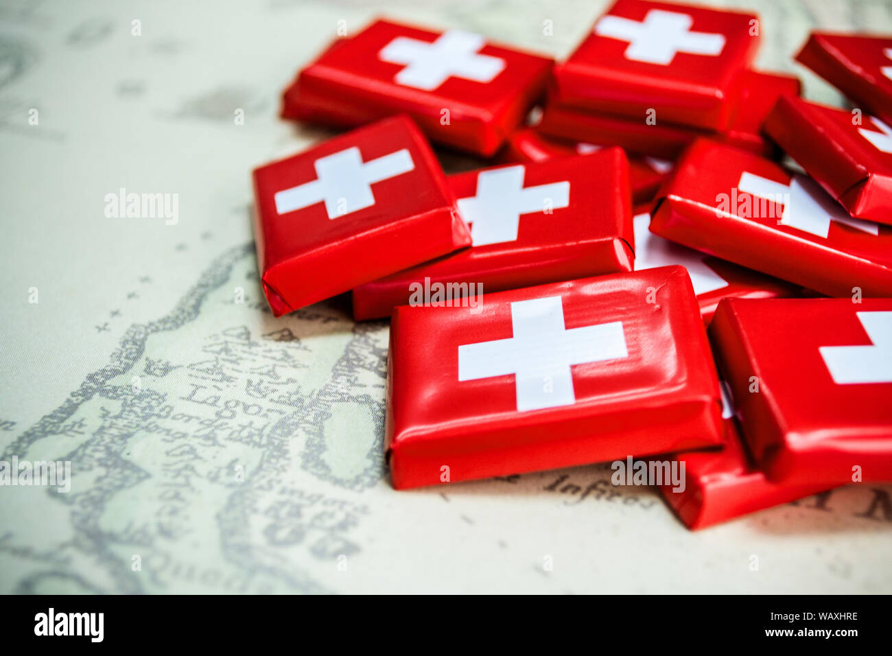 Swiss chocolate bar in swiss flag package Stock Photo - Alamy