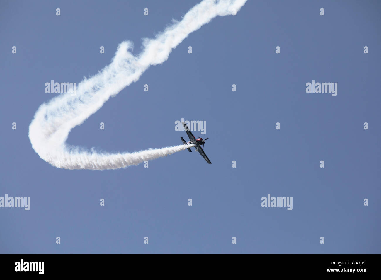 Aircraft aerobatics with smoke trails Stock Photo - Alamy