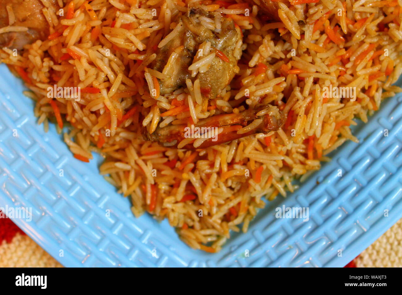 Closeup of chicken biryani in a plastic plate Stock Photo - Alamy